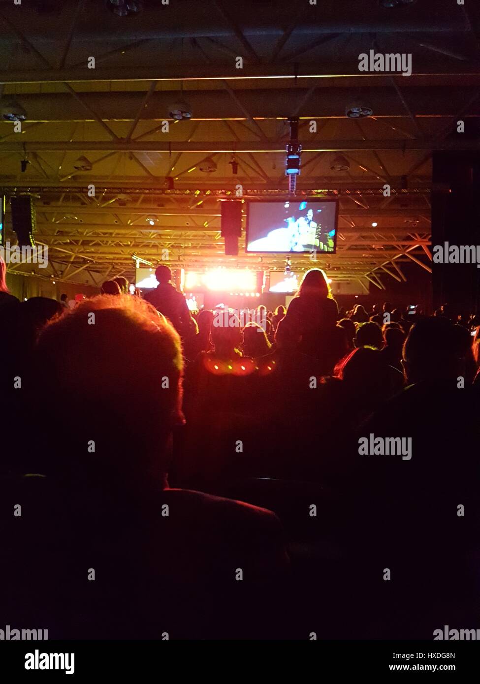 A concert showing stage performance where viewers trying to peek at ...