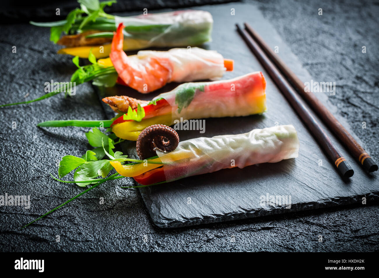 Fresh spring rolls wrapped in rice paper Stock Photo - Alamy
