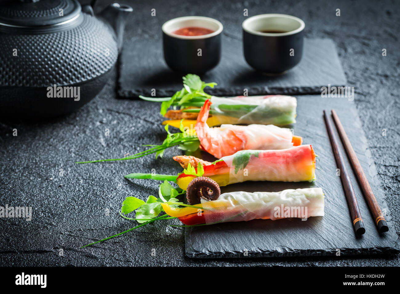 Fresh spring rolls wrapped in rice paper Stock Photo - Alamy