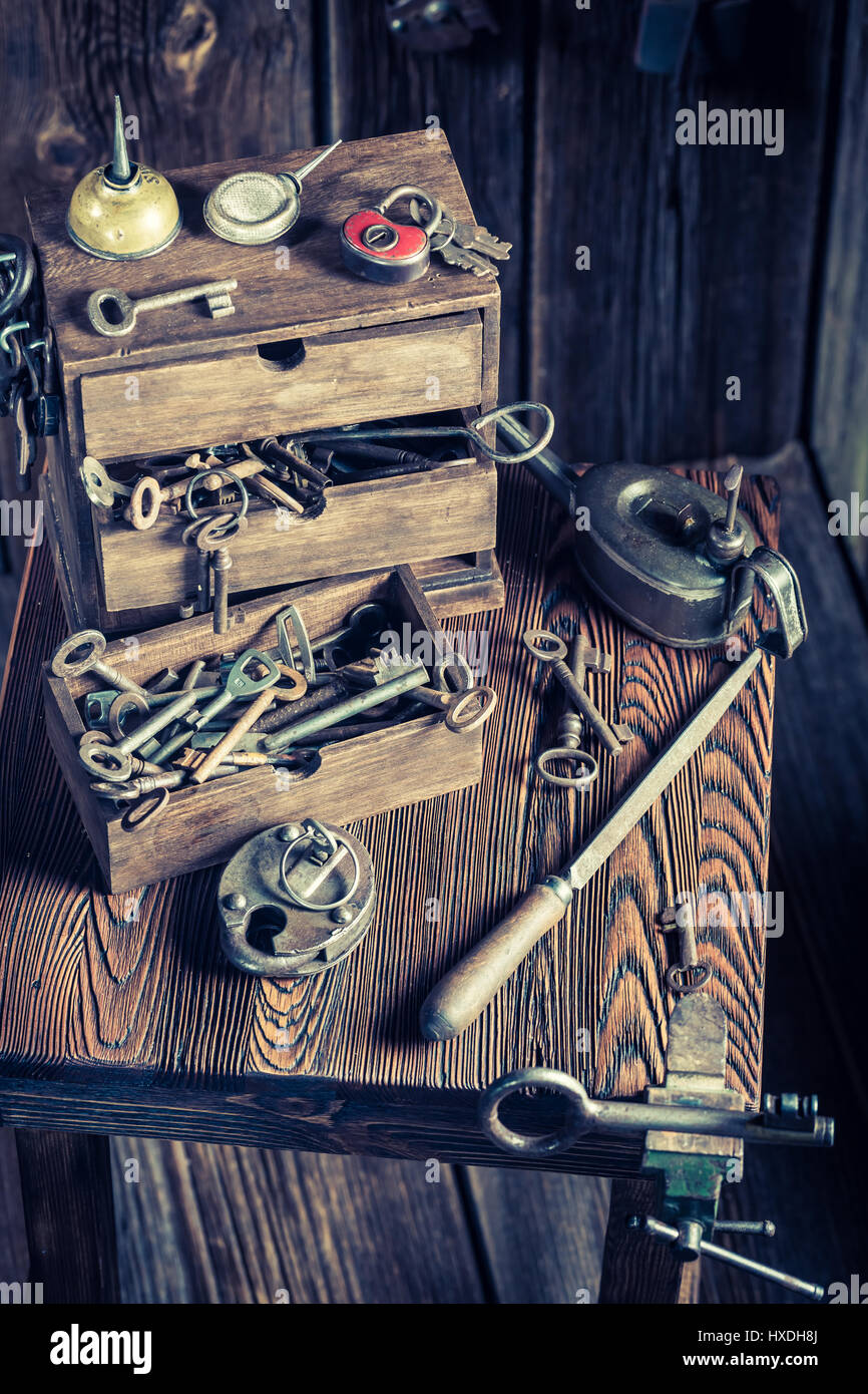 Vintage locksmiths workshop with tools to repair Stock Photo - Alamy