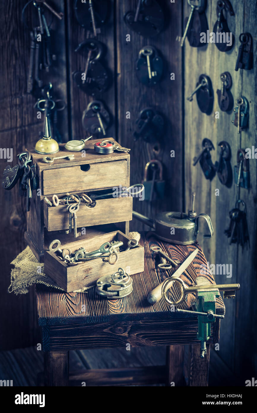 Small locksmiths workshop with tools to repair Stock Photo - Alamy