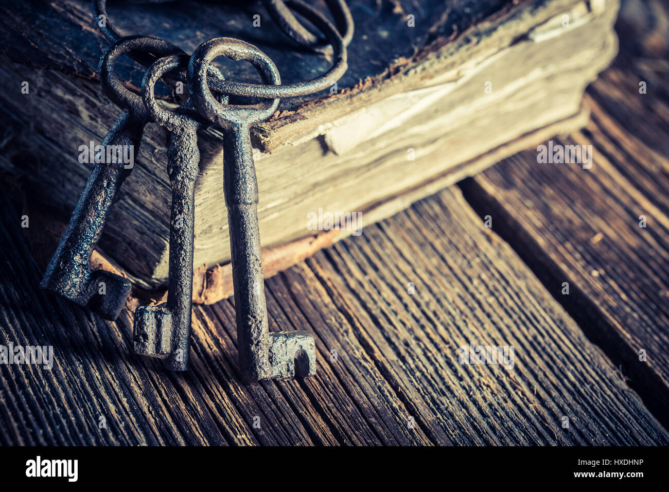 Vintage keys and books on old wooden table Stock Photo - Alamy