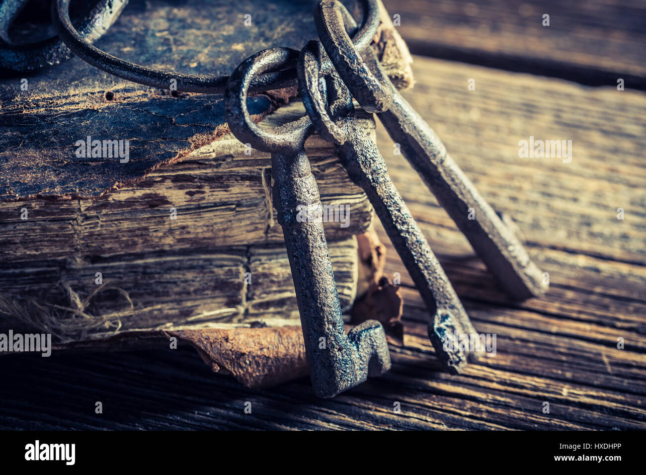 Old books and keys on old wooden table Stock Photo - Alamy