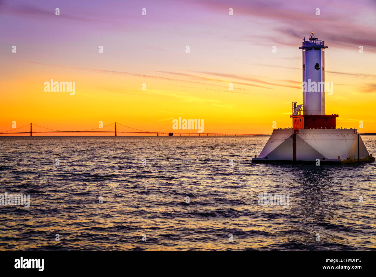 View of lighthouse and the Mackinac Bridge in Michigan at sunset Stock ...