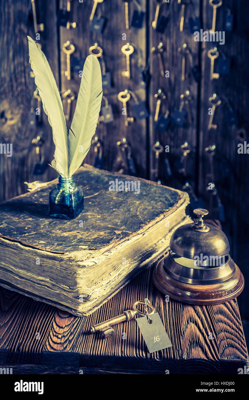 Keys for rooms and guestbook in vintage reception in hotel Stock Photo ...
