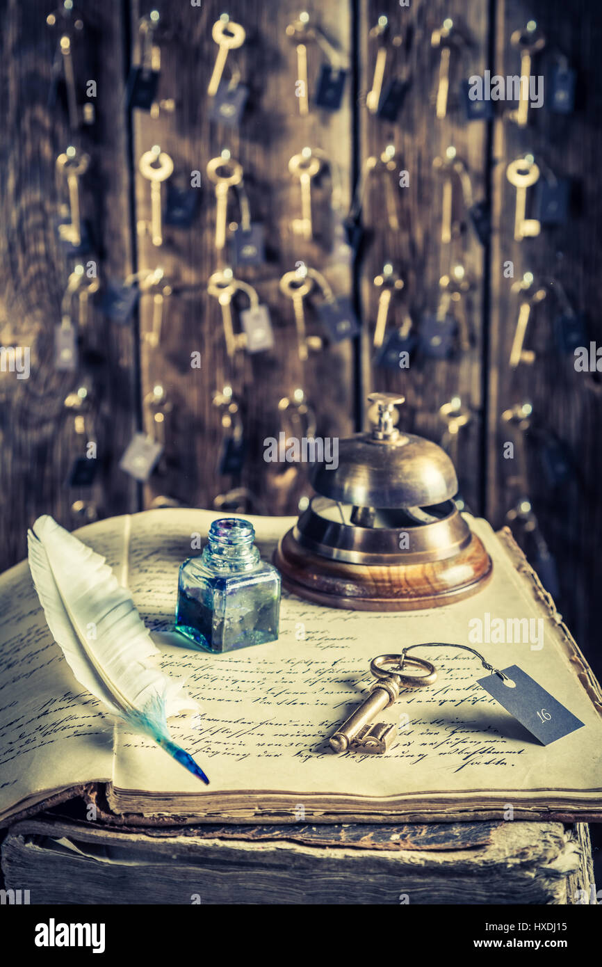 Keys for rooms and guestbook in vintage front desk in hotel Stock Photo ...