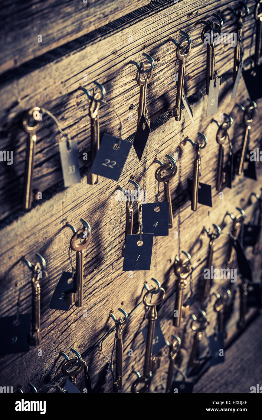 Old keys with number in hotel Stock Photo - Alamy