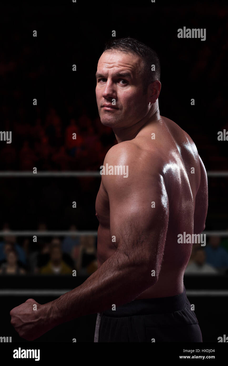 professional kickboxer with hands in martial arts position training for ...