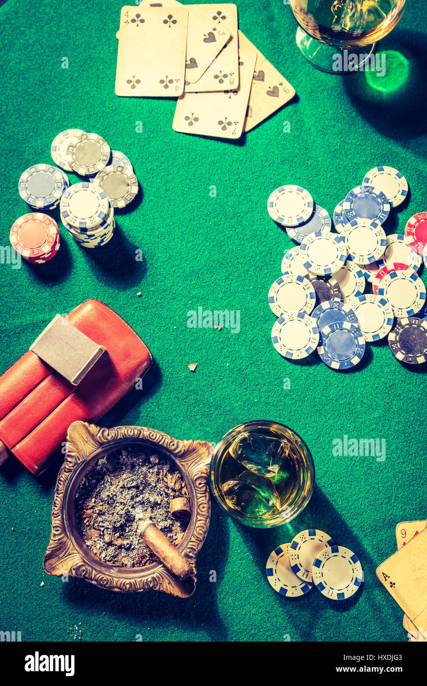 Whiskey, cigar and cards in old gambling table Stock Photo - Alamy
