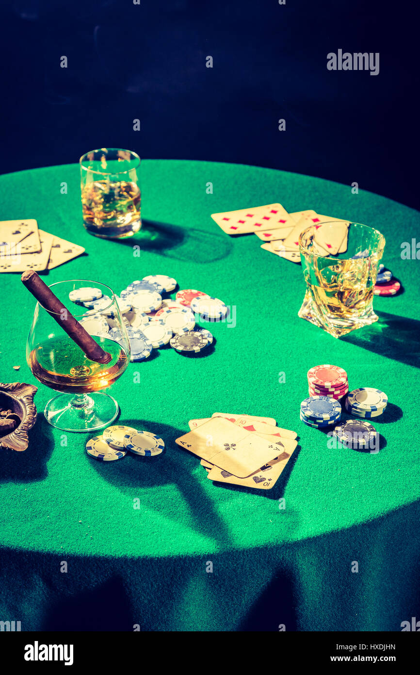 Table for poker with chips and cards Stock Photo - Alamy