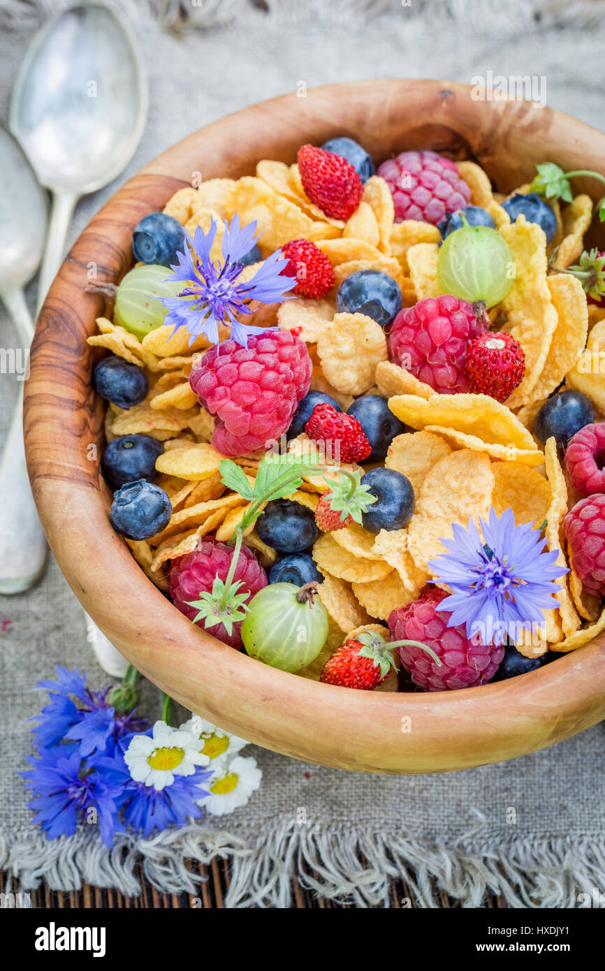 Cornflakes with berry fruits in sunny day Stock Photo - Alamy