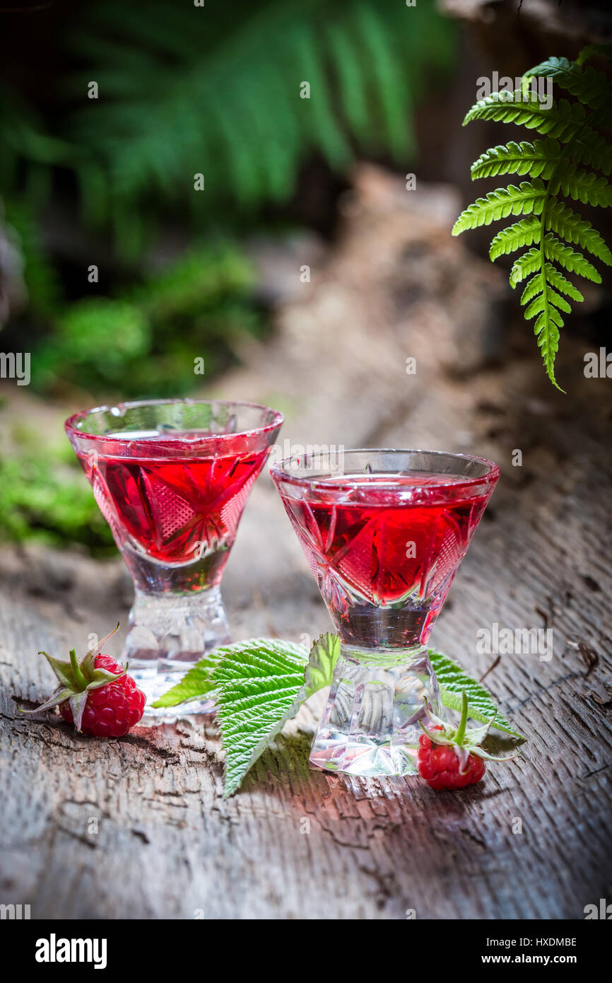 Sweet raspberries liqueur made of alcohol and fruits Stock Photo - Alamy