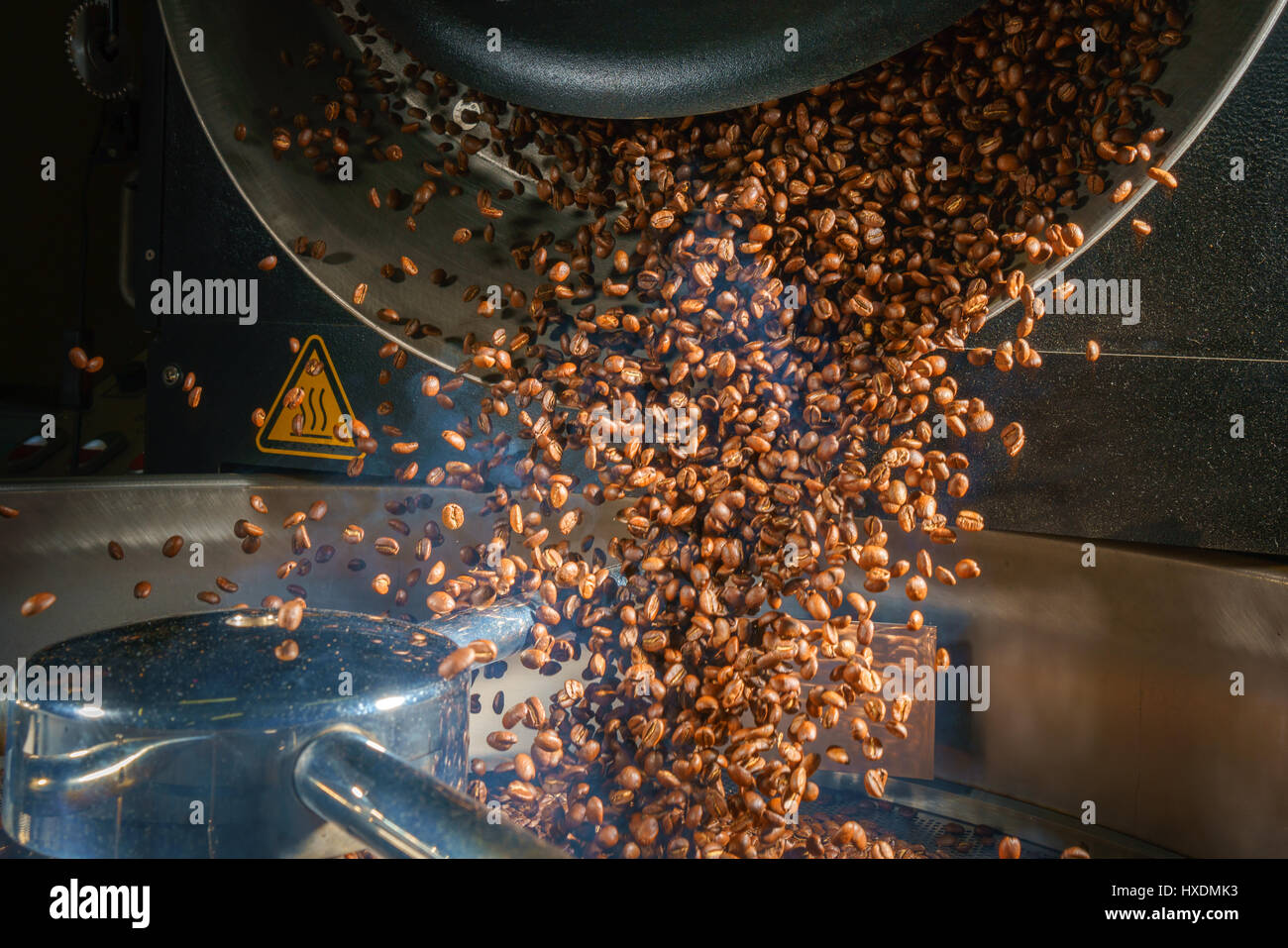 Mixing roasted coffee Stock Photo - Alamy