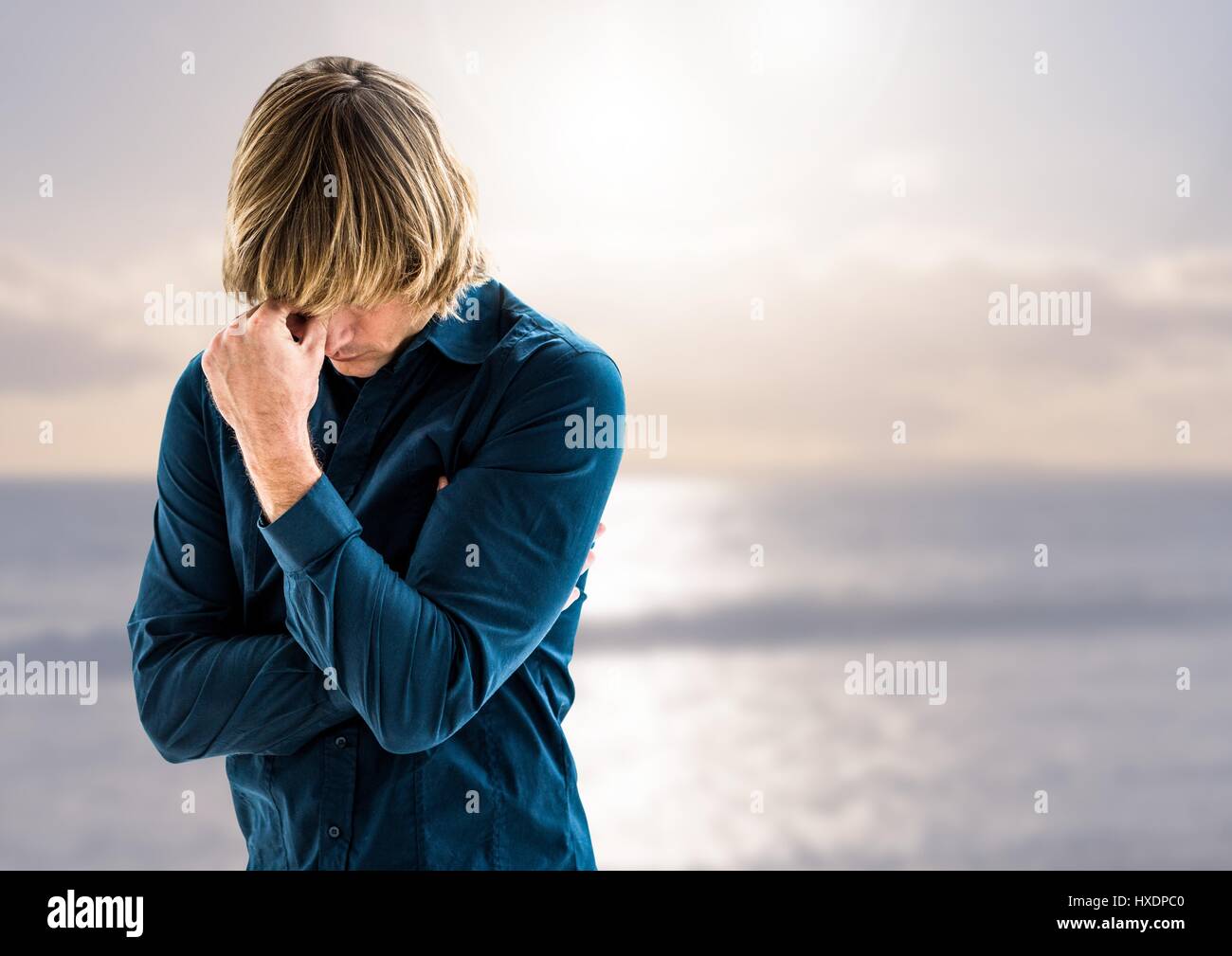 Digital composite of Sad depressed man in front of sea Stock Photo - Alamy