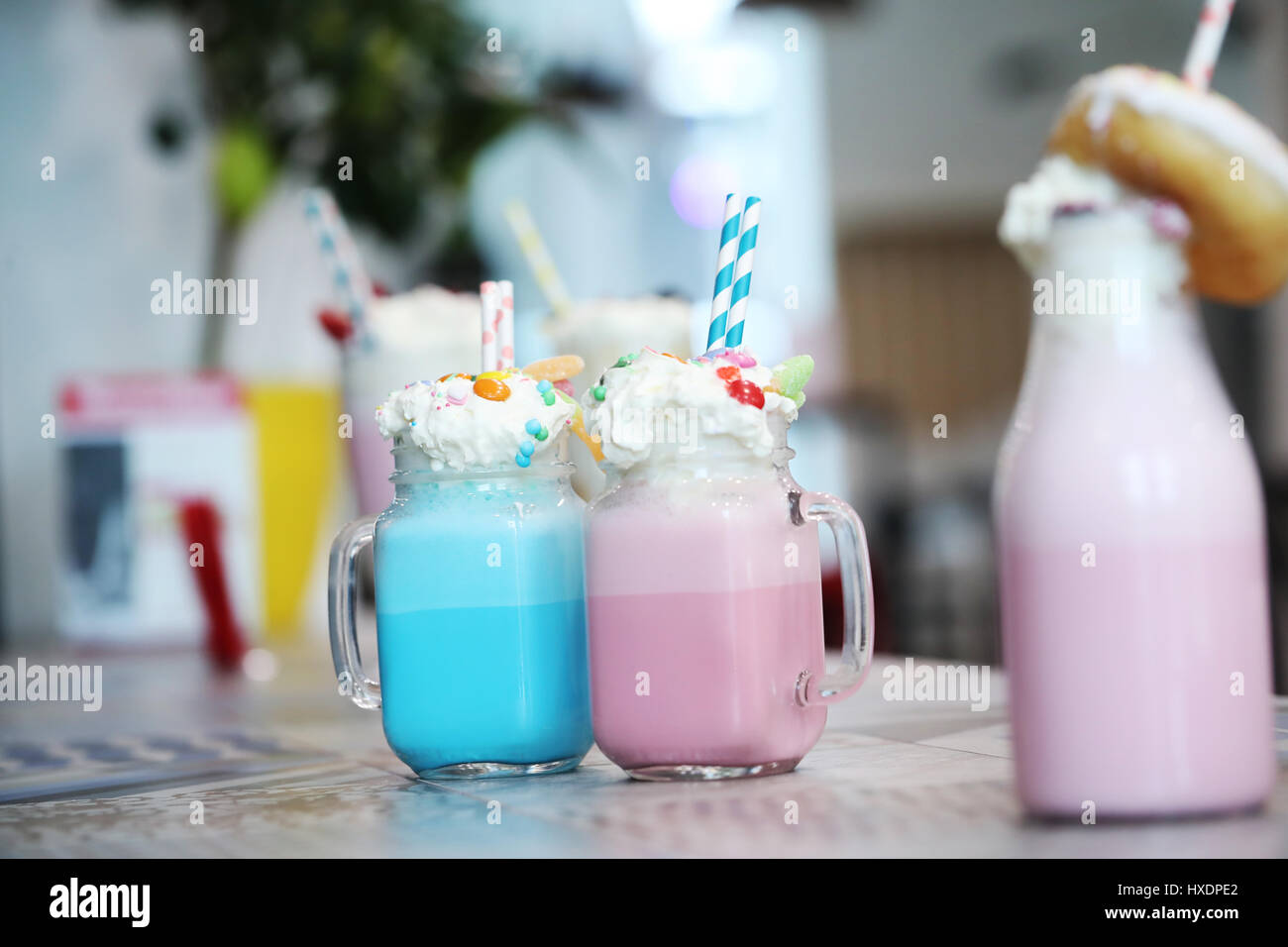 Glass pink milkshake decorated candy hi-res stock photography and ...