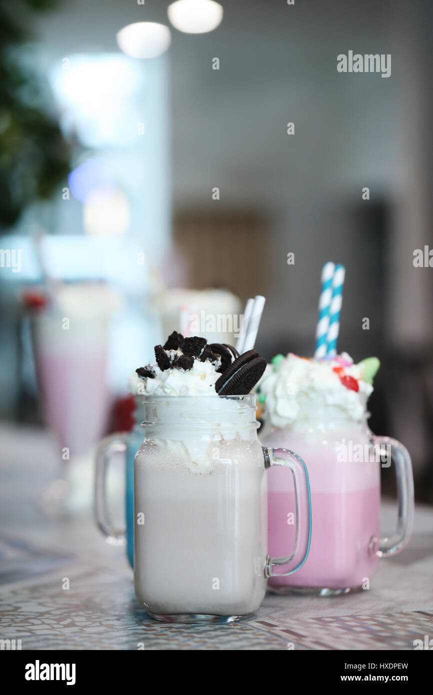 Glass pink milkshake decorated candy hi-res stock photography and ...