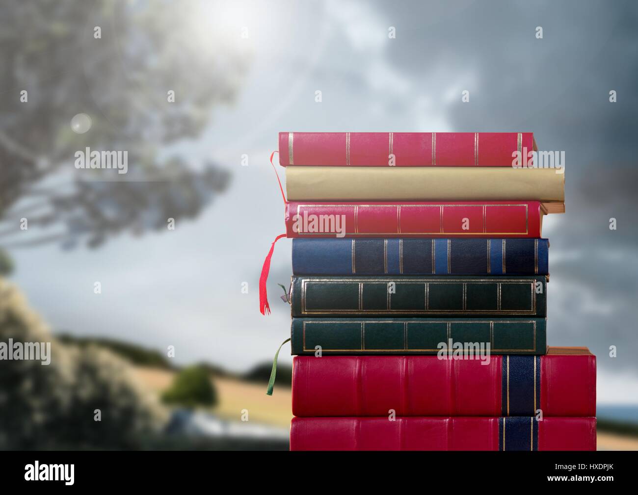 Digital composite of Books stacked by romantic nature landscape Stock ...