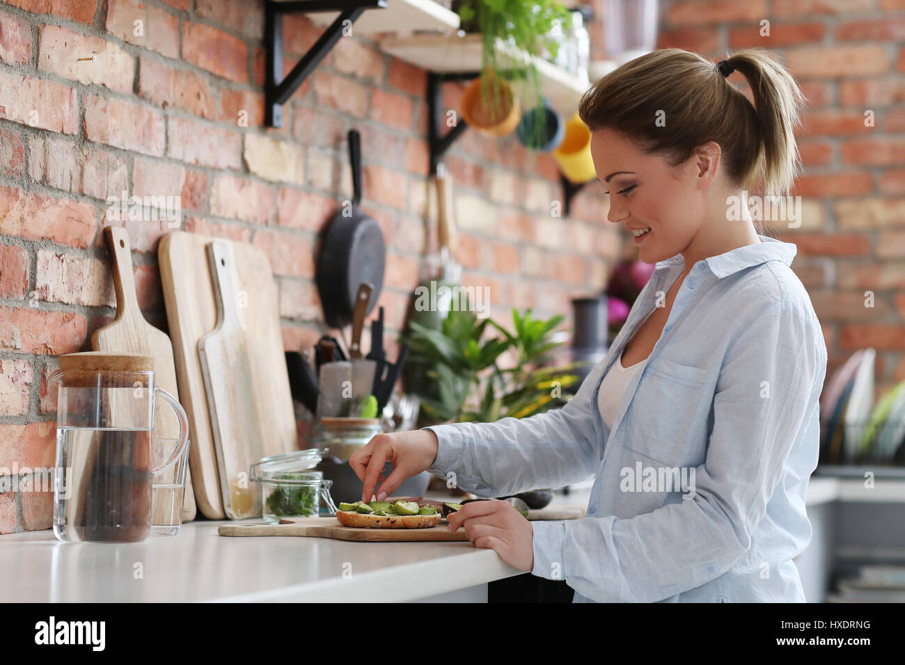 Woman in kitchen Stock Photo - Alamy