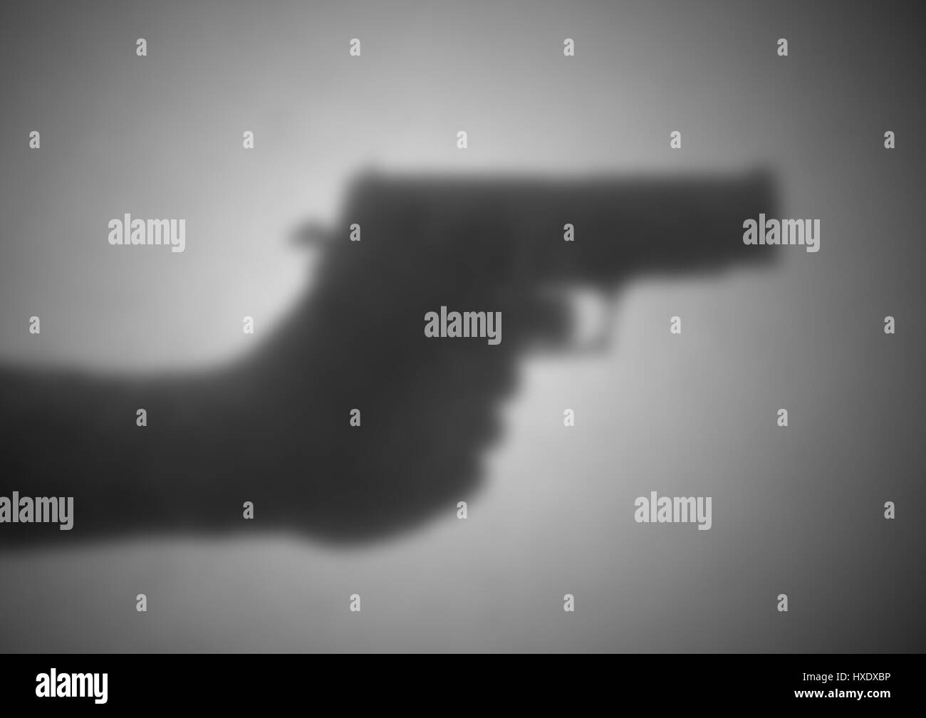 Silhouette behind a transparent paper - Blurred - Hand gun Stock Photo ...