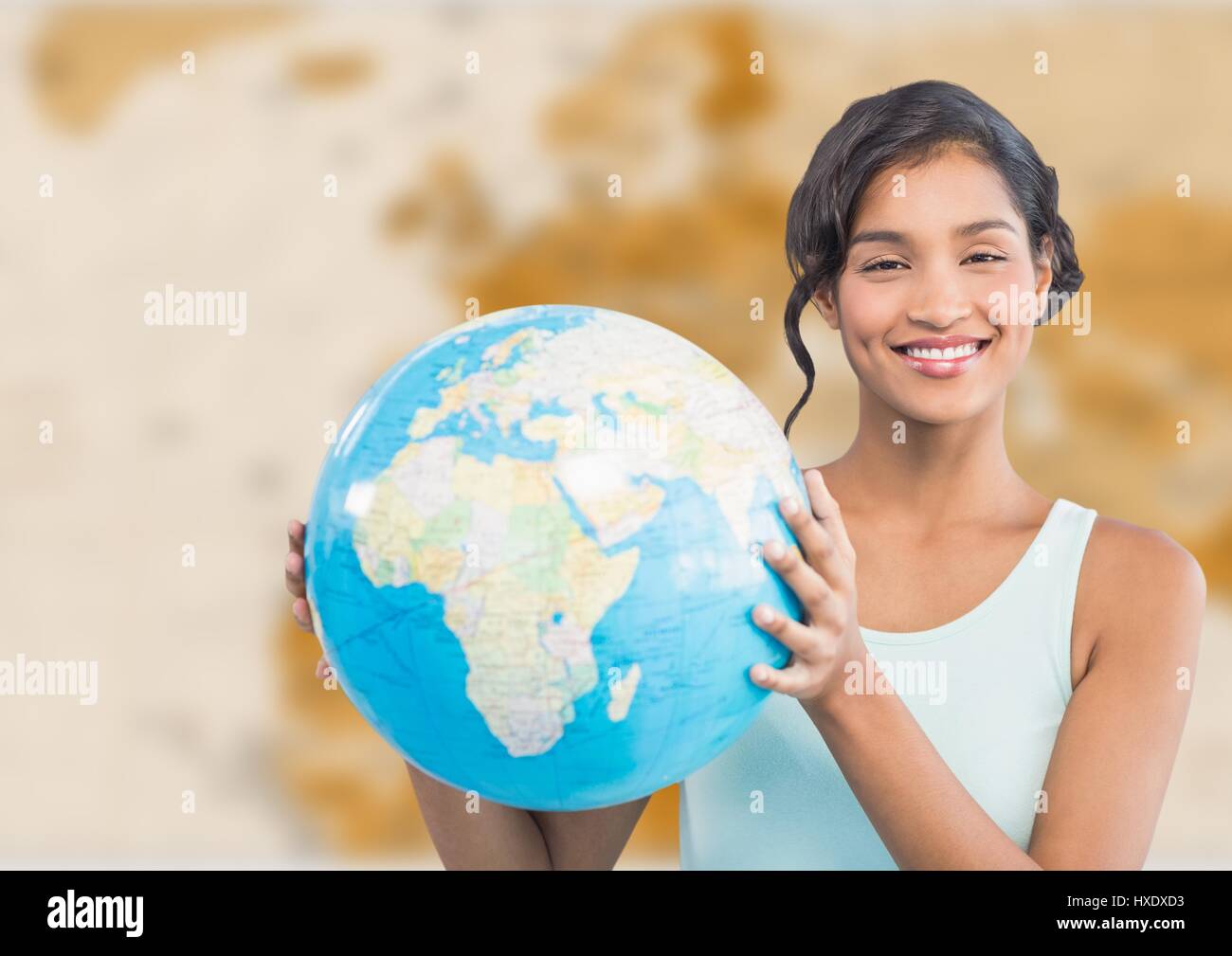 Digital composite of Woman with globe against brown blurry map Stock ...