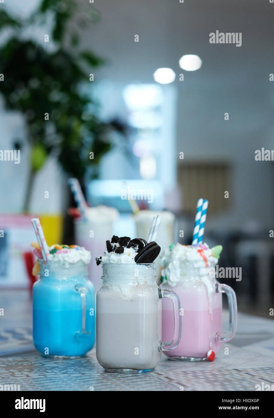 Glass pink milkshake decorated candy hi-res stock photography and ...