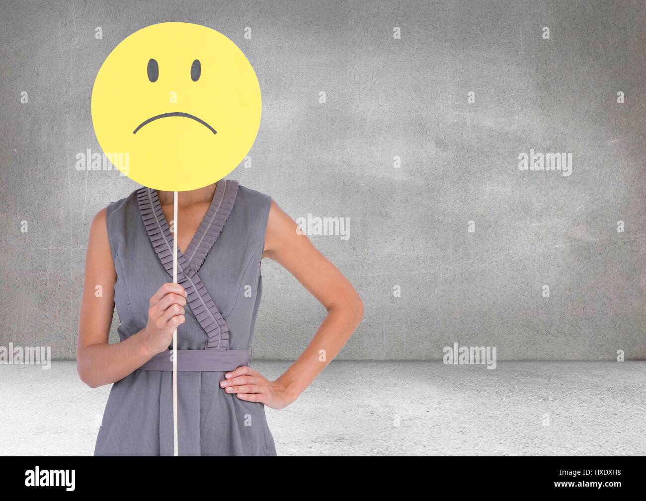 Digital composite of Sad woman holding face against grey background ...