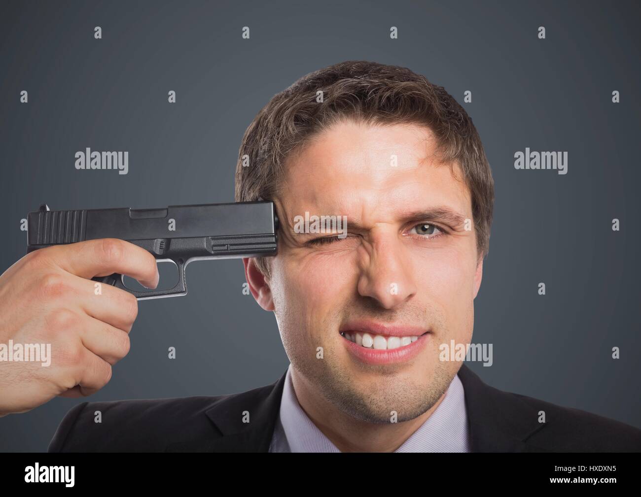 Digital composite of Close up of business man with gun to head against ...