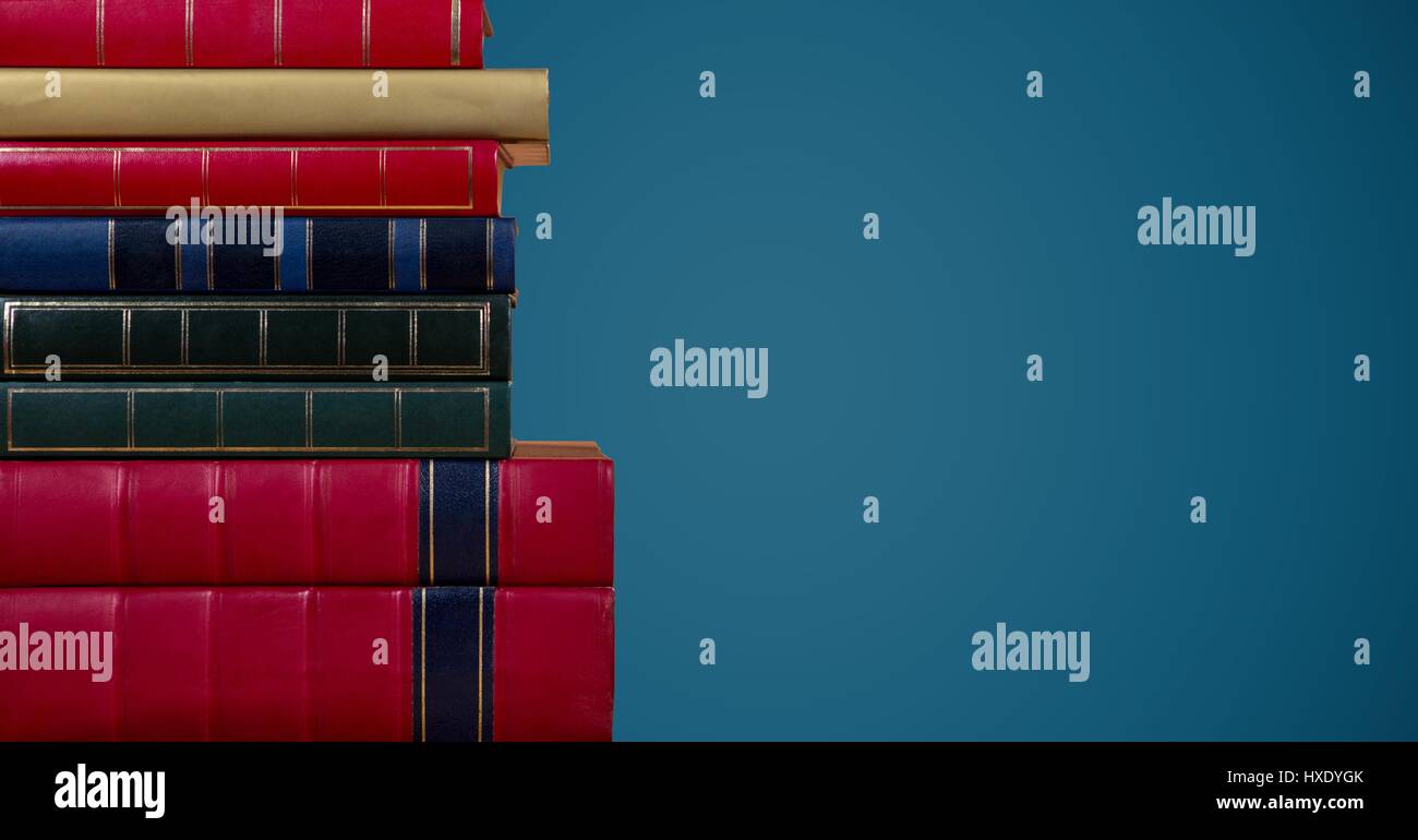 Digital composite of Pile of books against blue background Stock Photo ...