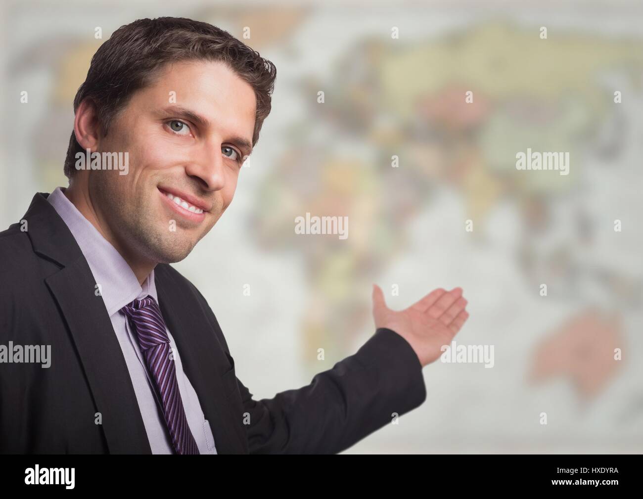 Digital composite of Business man gesturing towards blurry map Stock ...