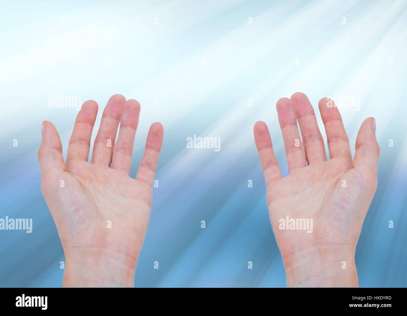 Digital composite of Hands asking for help open reaching against light ...