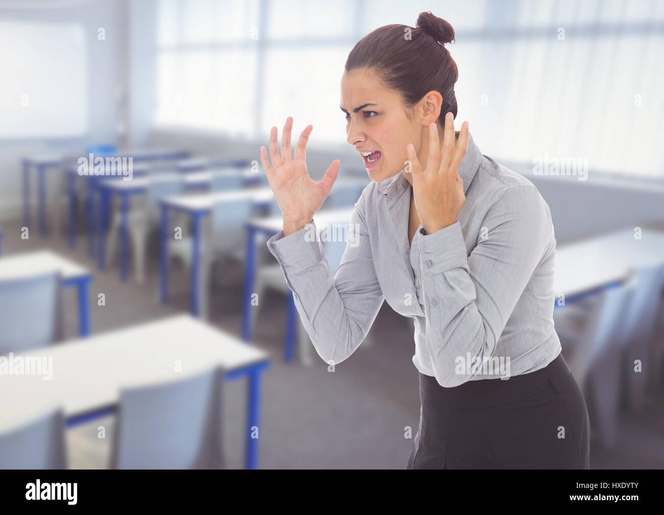 Digital composite of Stressed woman shouting in classroom Stock Photo ...