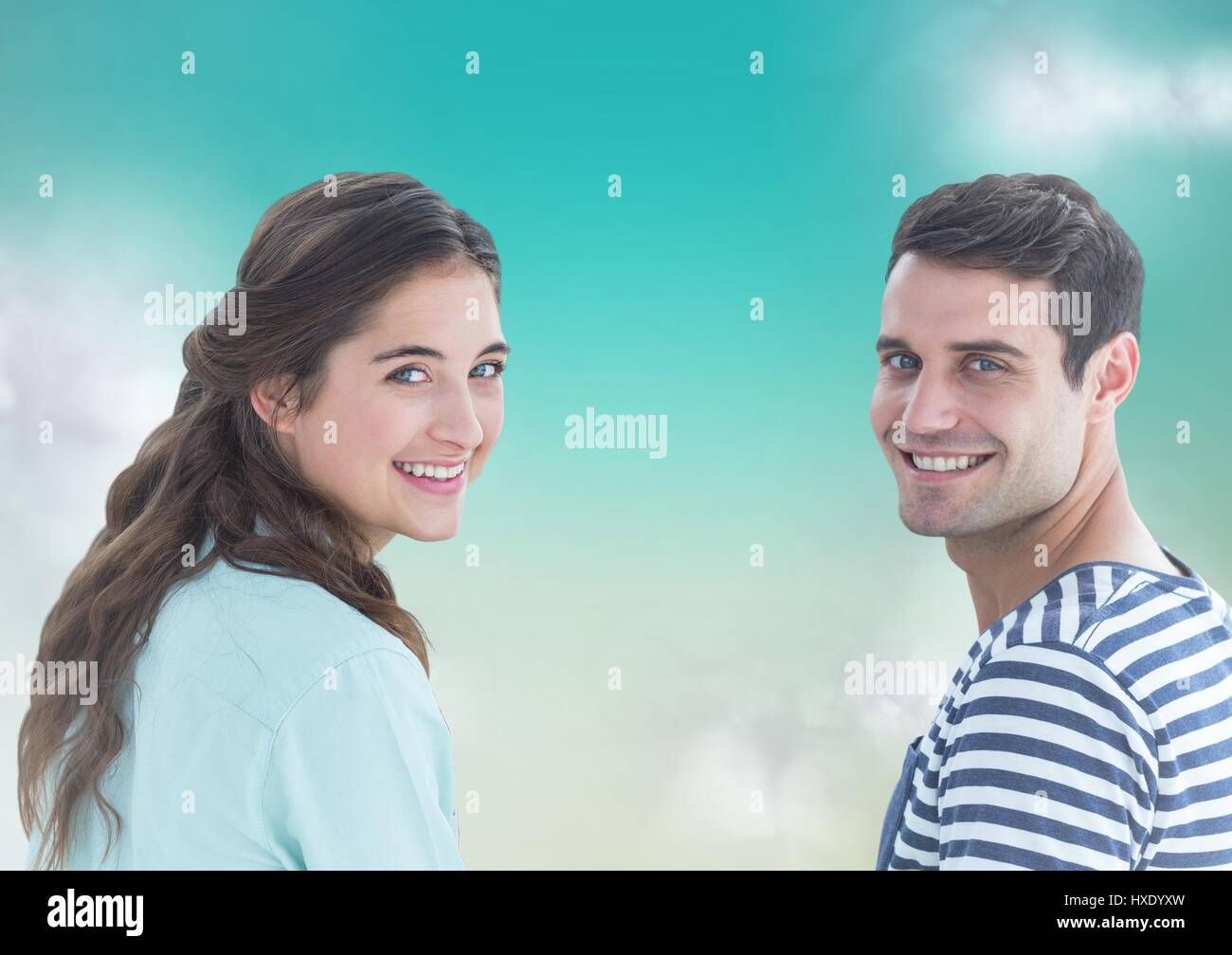 Digital composite of Couple looking over shoulders against blue green ...