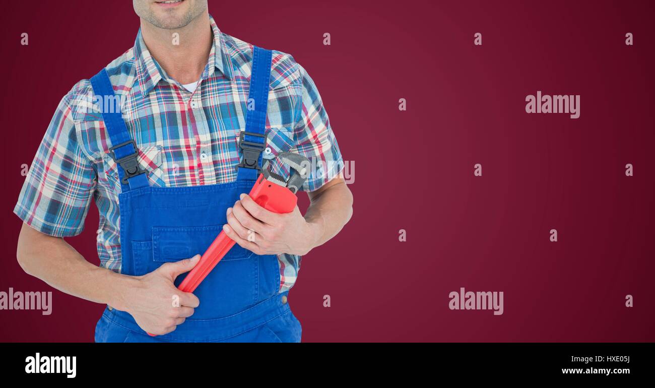 Digital composite of Mechanic with red wrench against maroon background ...