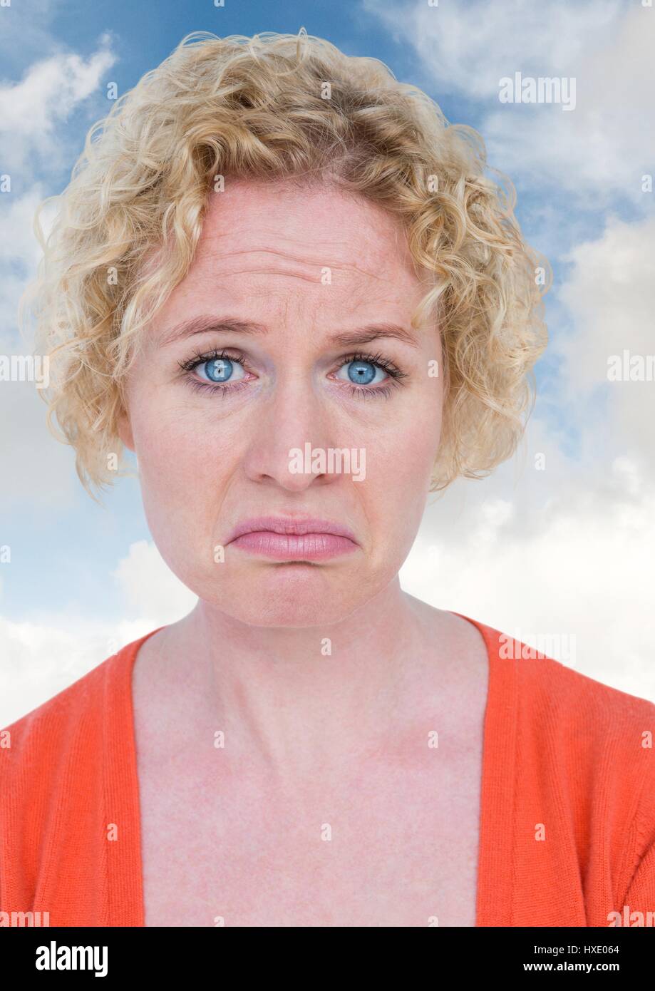 Digital composite of Sad woman crying against blue sky Stock Photo - Alamy