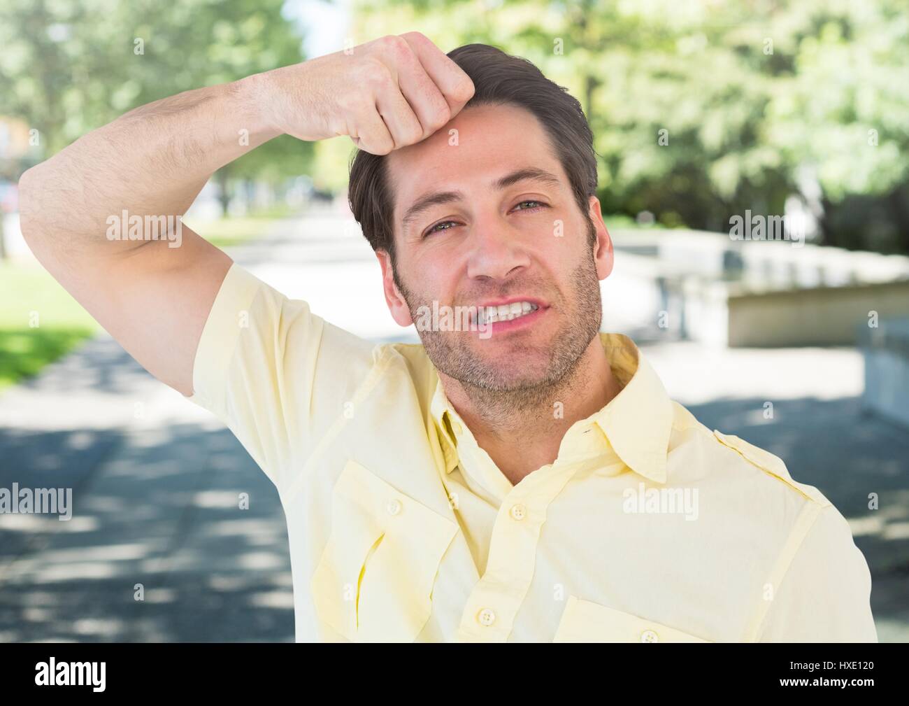 Digital composite of Stressed man in park Stock Photo - Alamy