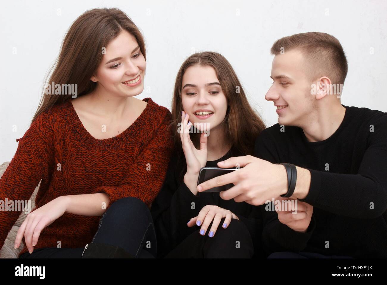 Three young friends Stock Photo - Alamy