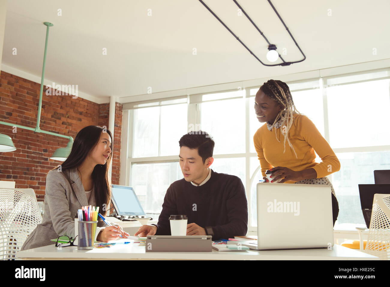 Group executives sitting working together hi-res stock photography and ...