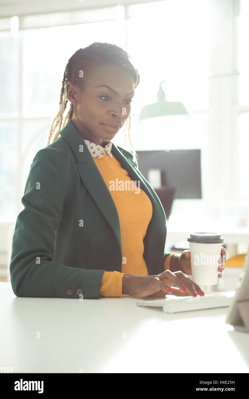Female executive working on digital tablet at desk in office Stock ...