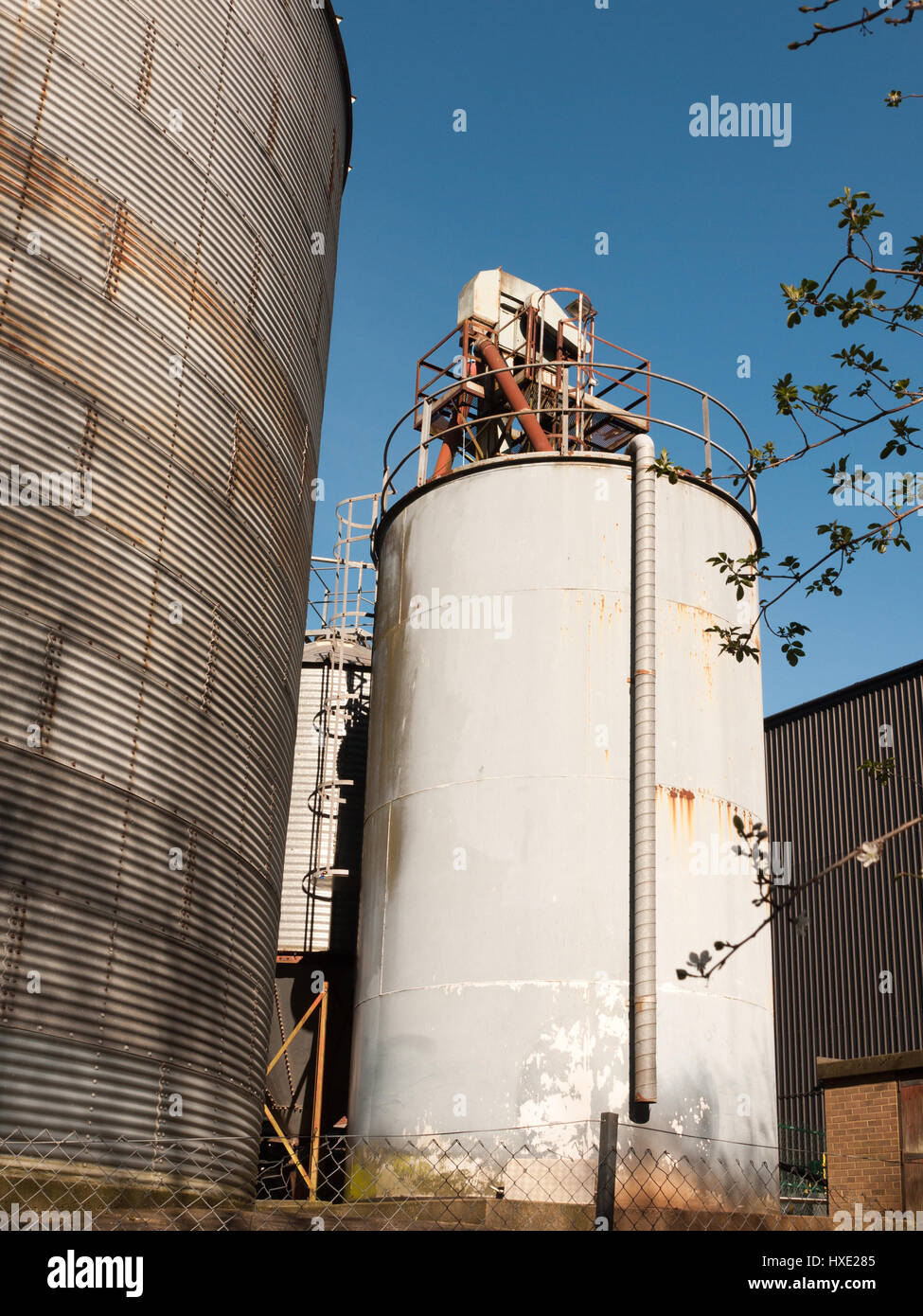 An amazing shot of some industrial buildings rising up Stock Photo - Alamy