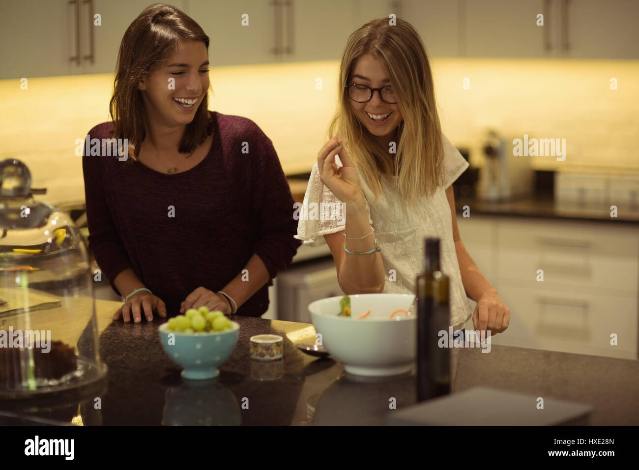Happy friends interacting with each other at home Stock Photo - Alamy
