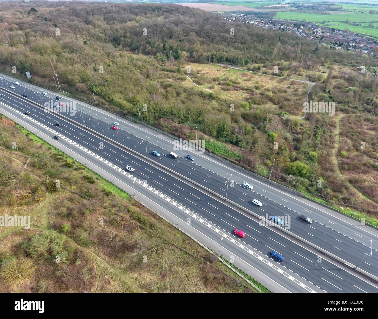 Aerial view of cars on a motorway in an English countryside, between ...