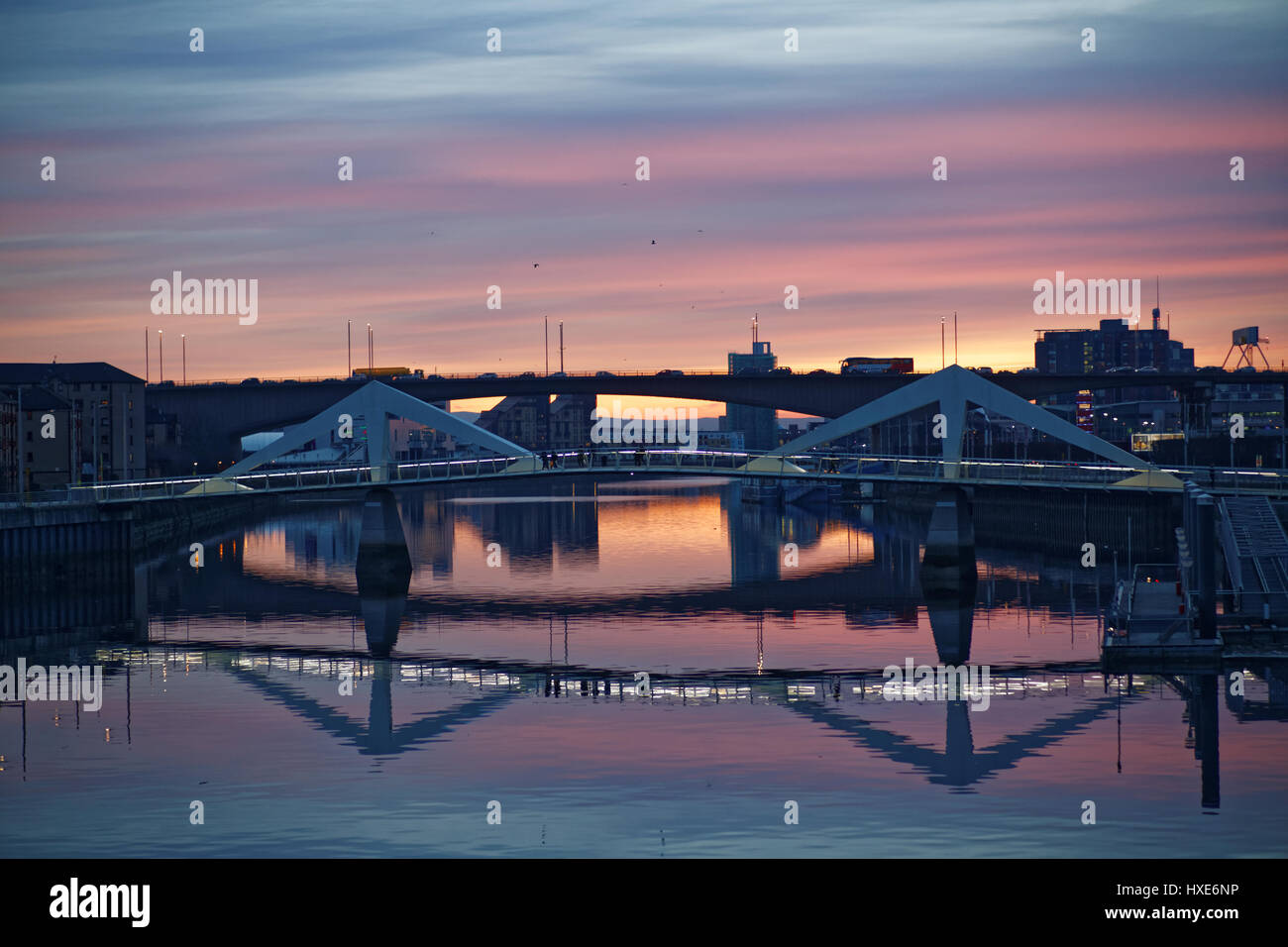 Squiggly bridge Tradeston Bridge at twilight on the Clyde Stock Photo ...