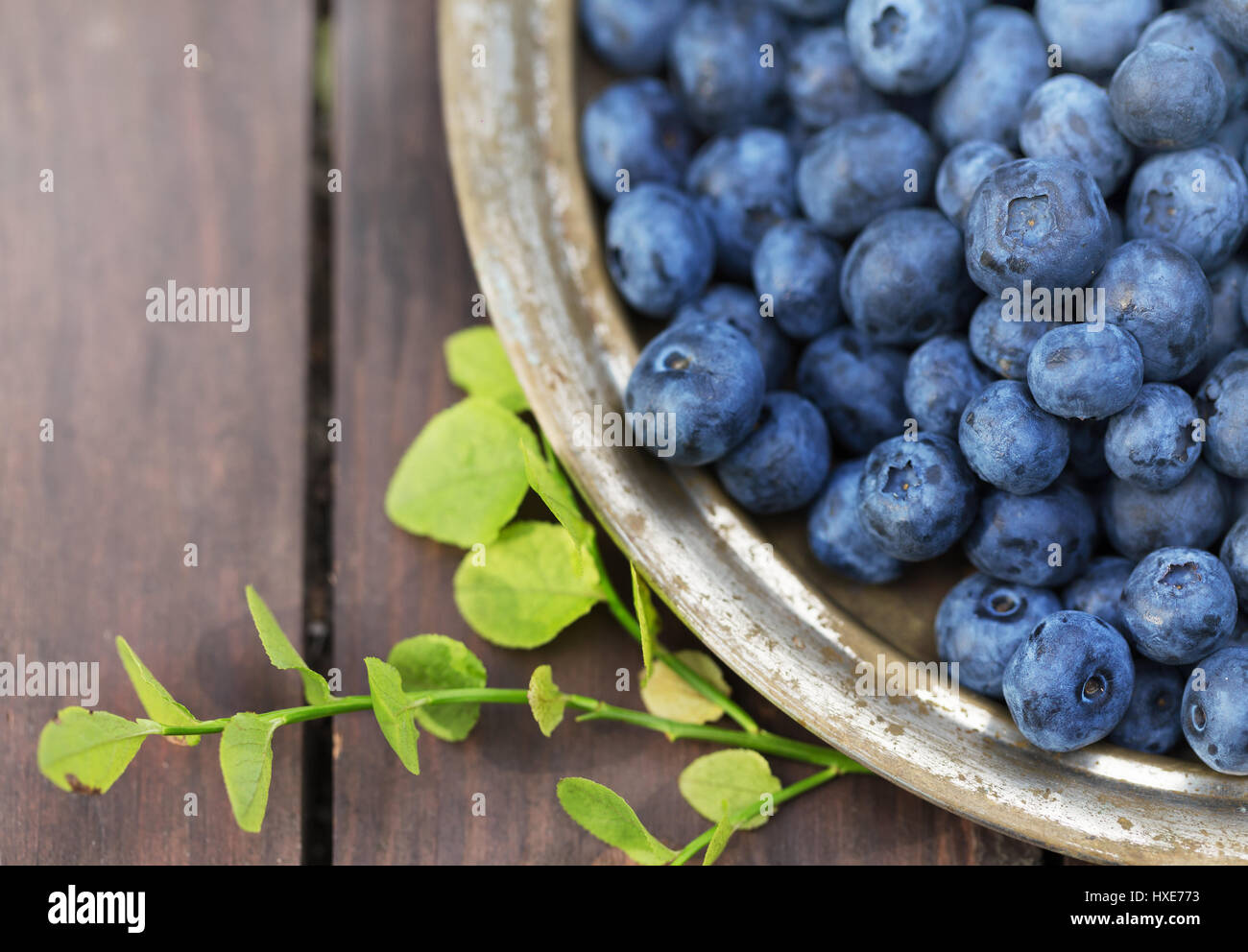 Fresh ripe sweet blueberries outdoors on plate Stock Photo - Alamy