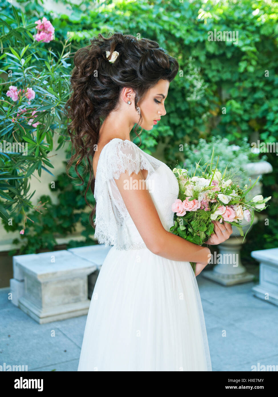 Tender beautiful bride with a bouquet Stock Photo - Alamy