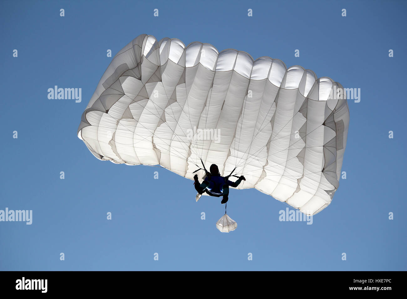 parachutist on blue sky extreme sport Stock Photo - Alamy
