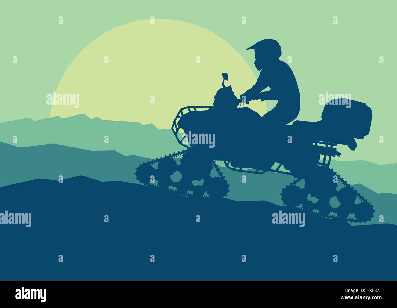 All terrain vehicle with chains driving in snow and mud landscape ...