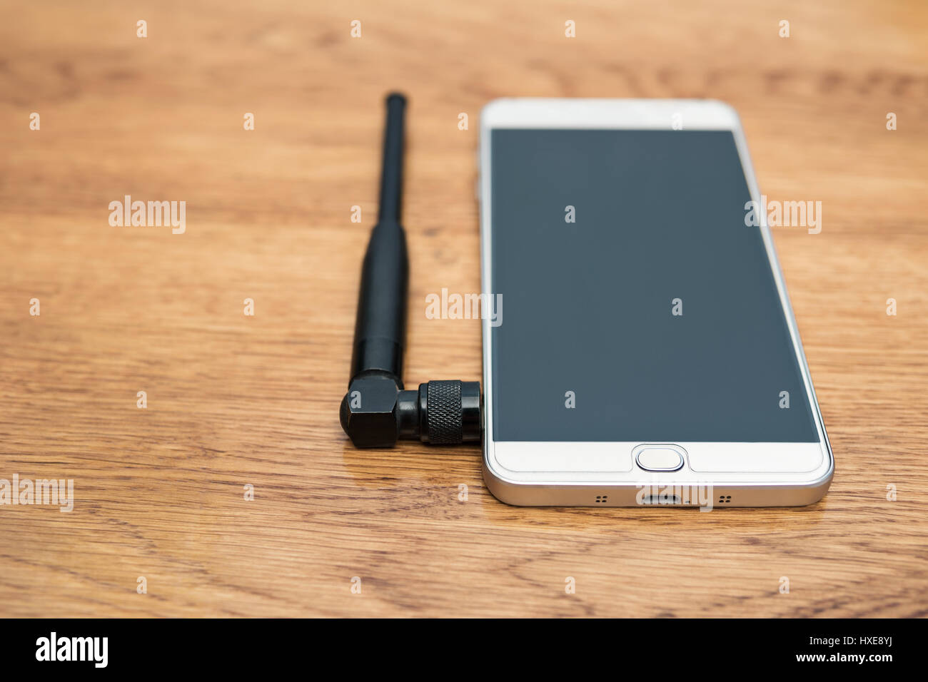 Concept phone with a small antenna Stock Photo - Alamy