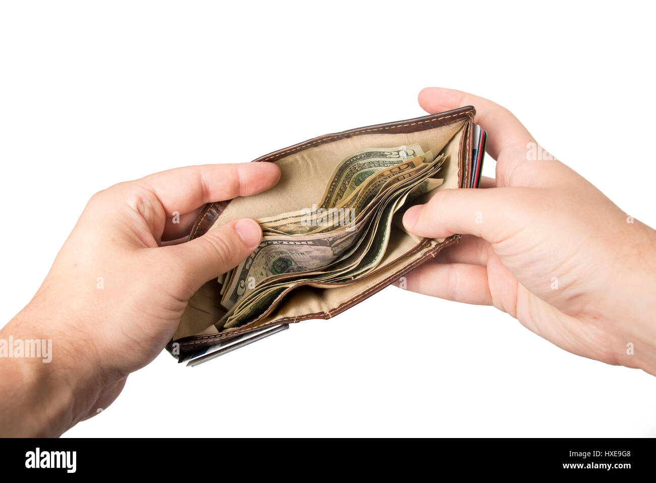 A wallet with cash (American dollars) being held open by a white male ...