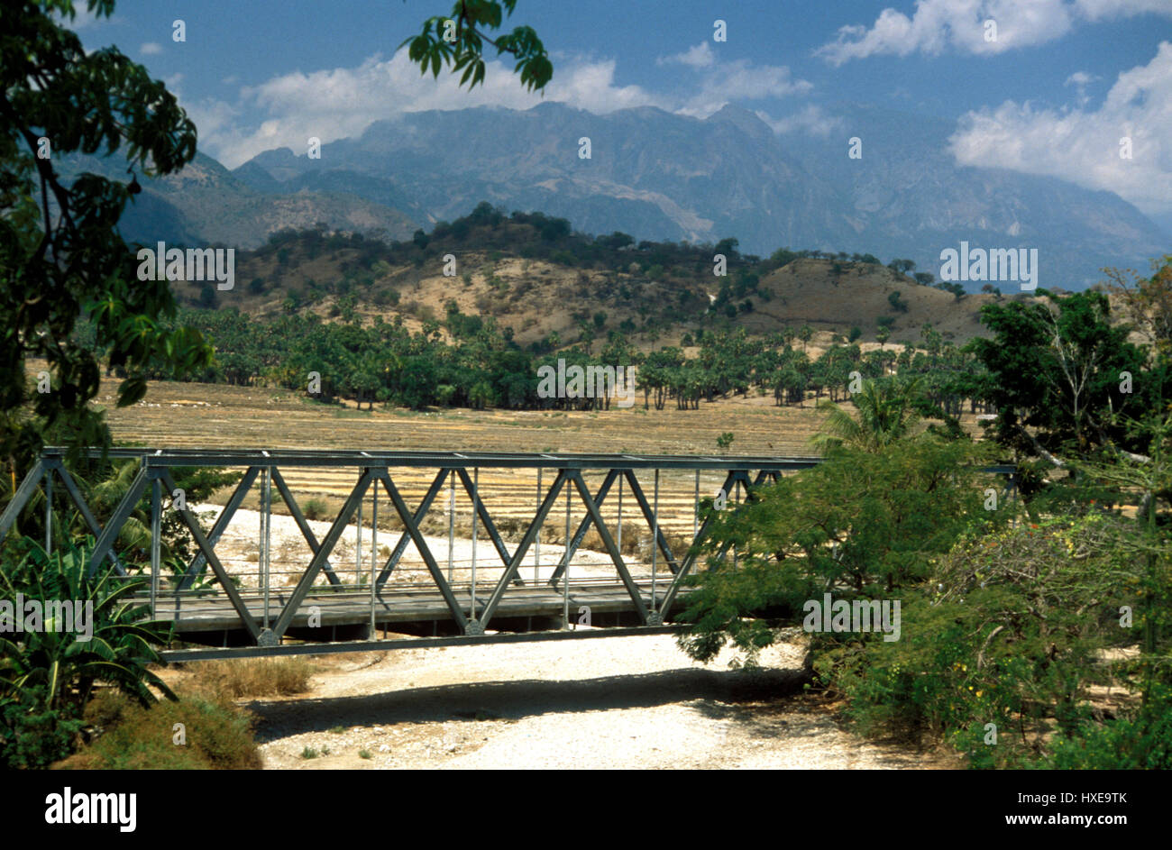 Bridge at Laga on the north coast of East Timor, with Mount Matebian, a ...