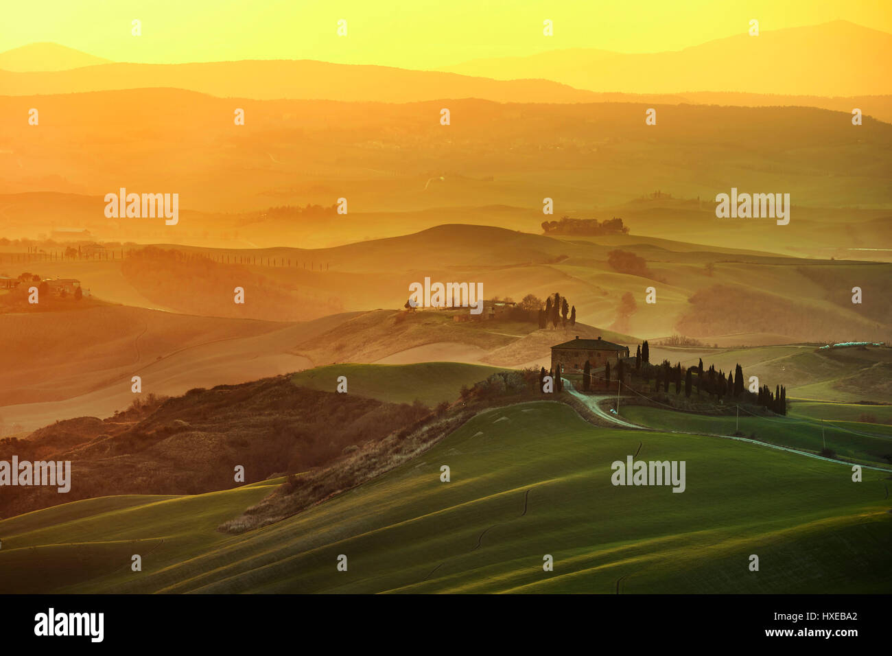 Tuscany spring, rolling hills on misty sunset. Rural landscape. Green ...